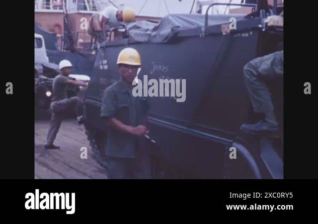 1969 - Korean workers drive an M-113 armored personal carrier off a ...