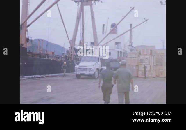 1969 - Korean workers unload a cargo ship at a pier in Vietnam ...