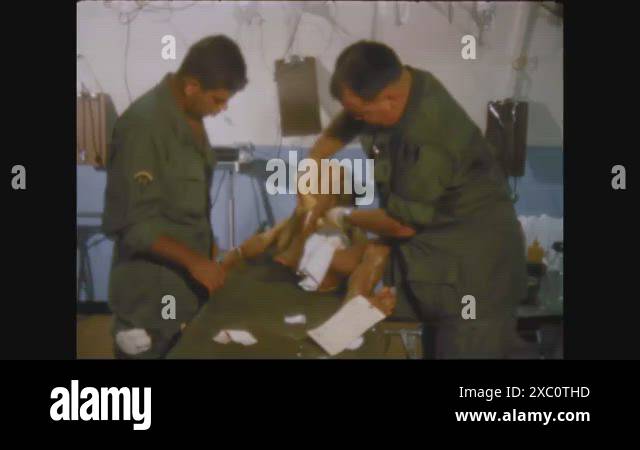 1969 - A US Army medic cleans the wounds of a newly arrived Vietnamese ...