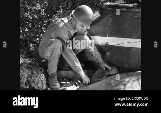 1943 - Checking gasoline and ammunition in tanks in preparation for ...