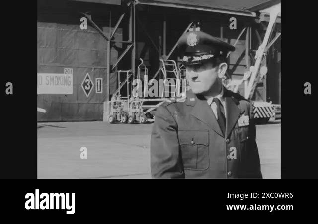 1955 - Jimmy Stewart gets in the cockpit of an F-86D and tries on a flight helmet at Yokota Air ...