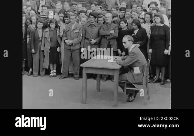 1945 - A female Nazi collaborationist is interrogated at Camp Kochstadt ...