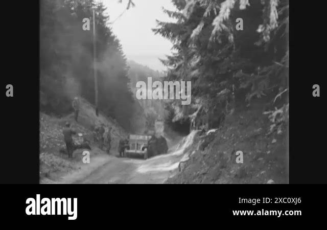 1945 - Nazi POWs help push US Army vehicles up a muddy hill in Germany ...