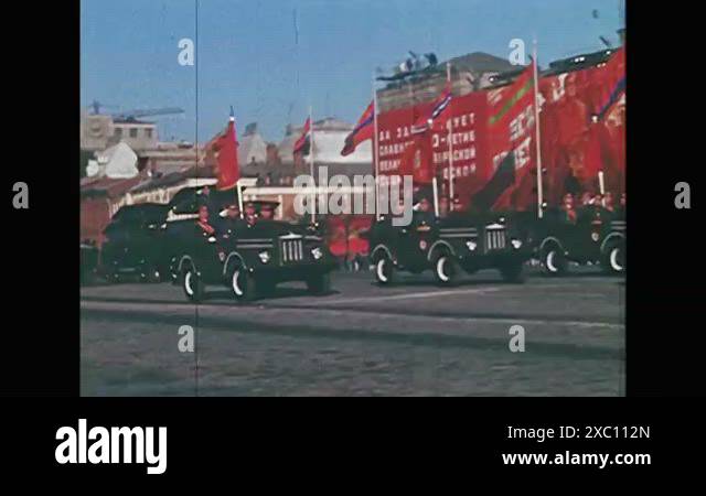 1968 - A parade is held in Moscow, Russia by a large banner of Lenin to ...