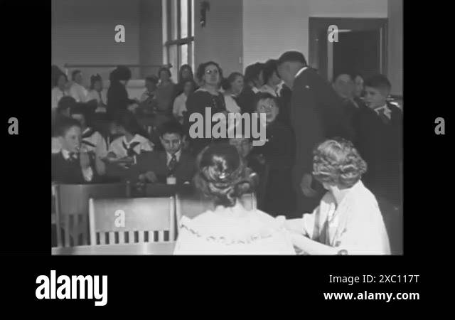 1918 - Students eat in the school cafeteria, and one shows off his ...