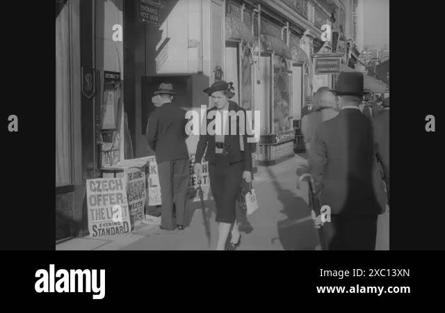 1940 - Supporters of fascist Oswald Mosley pass out antiwar flyers to ...
