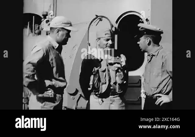1950 - A US Navy medical officer is hoisted up to a helicopter from the ...
