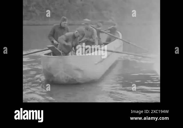 1918 - US Army engineers row a boat to a riverbank so a pontoon bridge ...