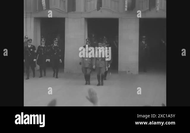 1937 - German civilians and servicemen stage a welcome for Adolf Hitler ...