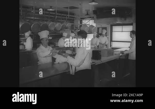 1937 - Chefs work in the kitchen of the Rainbow Room at Rockefeller ...