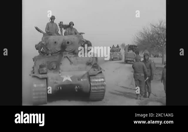 1945 - American soldiers of the 6th Armored Division drive tanks and ...