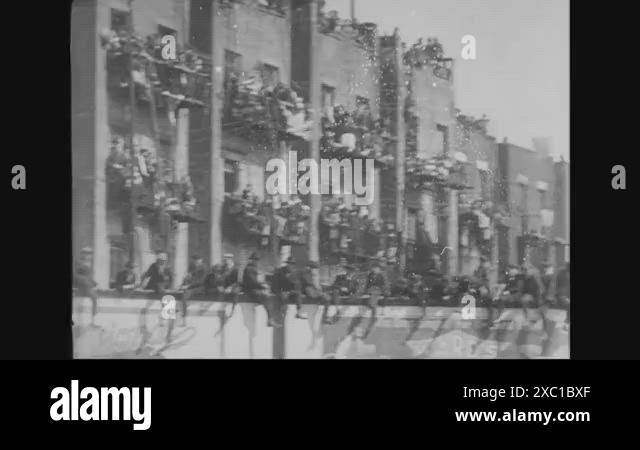 1919 - People hang out of their New York City tenement windows to cheer ...
