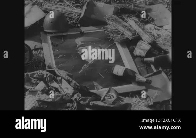 1944 - Broken portraits of Hitler lie in the streets of war-torn Paris ...