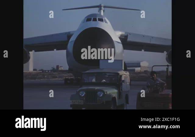 1973 - Stairs and the cargo door are opened on a C-141A at Dover Air Force Base Stock Video ...
