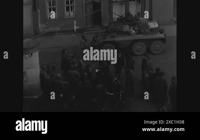 1945 - Men of the US Army's 4th Armored Division drive tanks through ...