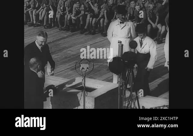 1935 - Adolf Hitler listens to Hjalmar Schacht give a speech at the ...