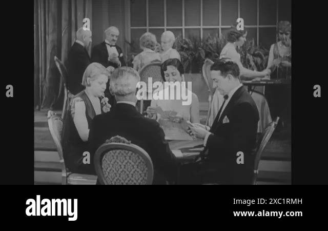 US - 1930 - in this comedy, two couples are playing bridge. A woman is ...