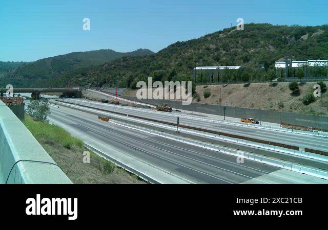 Pan left to right over an empty stretch of the 405 freeway in Los ...