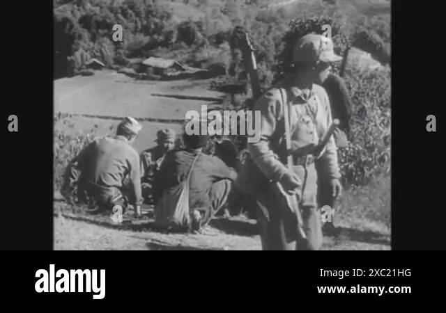 1945 - US Army Kachin Rangers and their local recruits pack up their ...