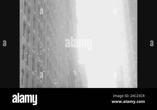 1960 - JFK and Jackie Kennedy drive through a ticker-tape parade en ...