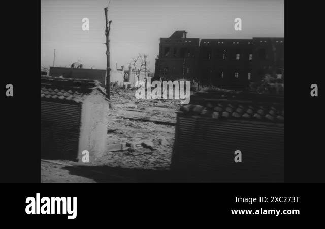 1945 - Civilians walk through the rubble of their war-torn neighborhood ...