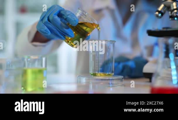 Yellow liquid beaker lab Stock Videos & Footage - HD and 4K Video Clips ...