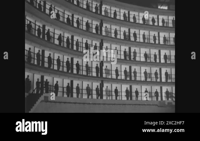 1930s - Panorama of a cell blocks in a circular prison, and inmates ...