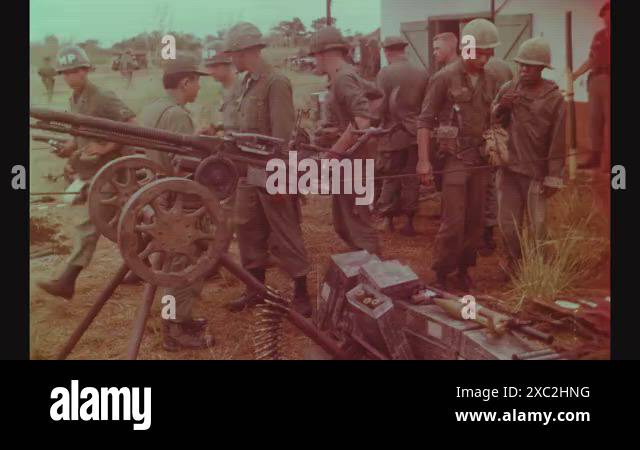1965 - American soldiers go over a stockpile of weaponry in Vietnam ...