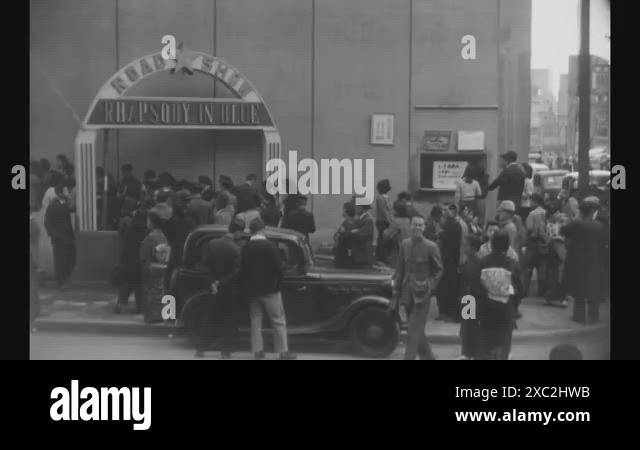 1947 - Japanese civilians line up outside the Subaru Theatre to see the ...
