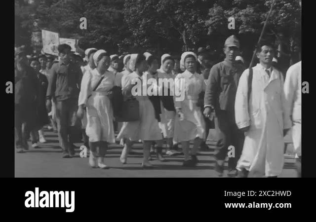 1947 - Japanese nurses and students march in a May Day parade, some ...