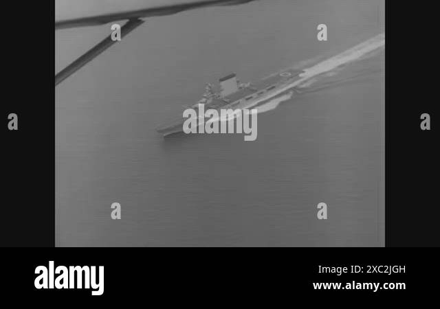 1933 - A US Navy plane takes off from an aircraft carrier and drops a ...