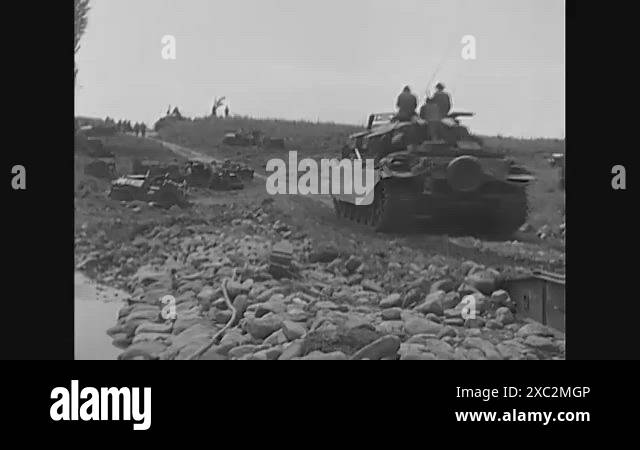 1951 - Men in the turret of an Australian army tank traverse the gun ...