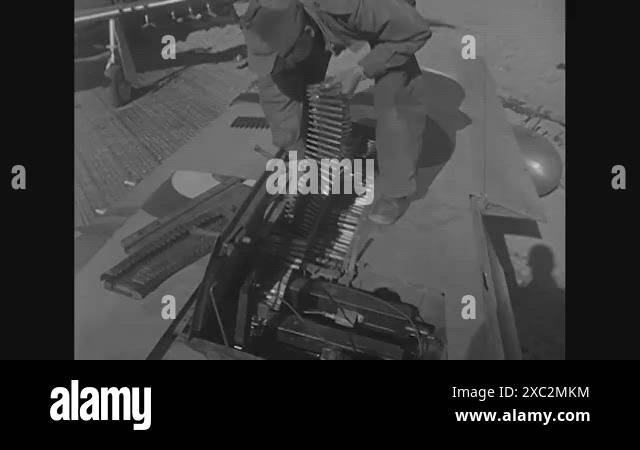 1950 - Australian airmen load machine gun belts into the wings of F-51 ...