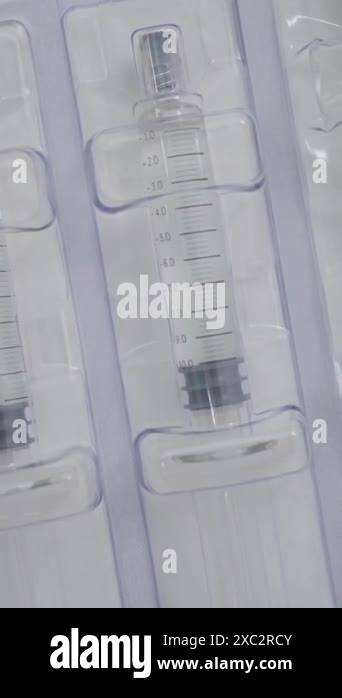 Close-up of medical syringe, marked with measurements, showcased in ...