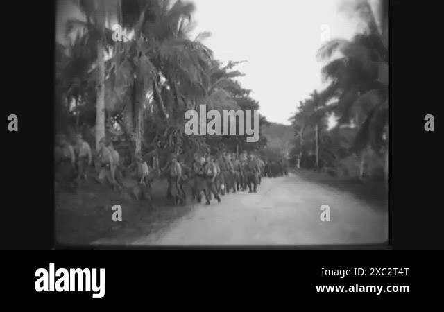 1945 - Japanese soldiers march through the jungle in Cebu, the Philippines, after their ...