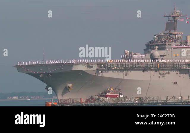 Navy families welcome home servicemen from an aircraft carrier Stock ...