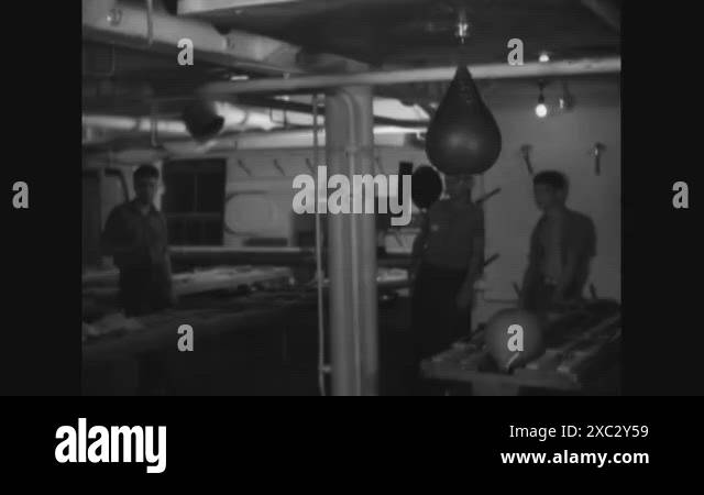 1944 - A US Navy boxer on the USS Enterprise works out with a speed bag ...