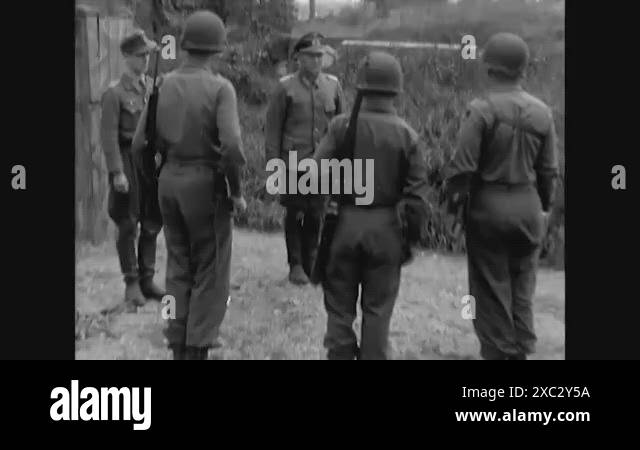 1945 - Nazi officers speak with their men and salute each other Stock ...