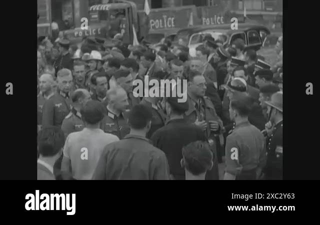 1944 - German POWs are gathered in Paris. French civilians of all ages ...