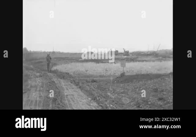 1945 - An American soldier reads a sign commemorating the spot where ...
