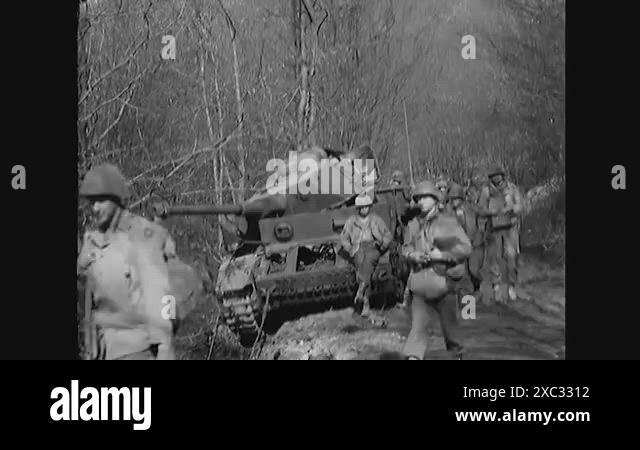 1945 - American soldiers march along a mountain trail in Germany ...