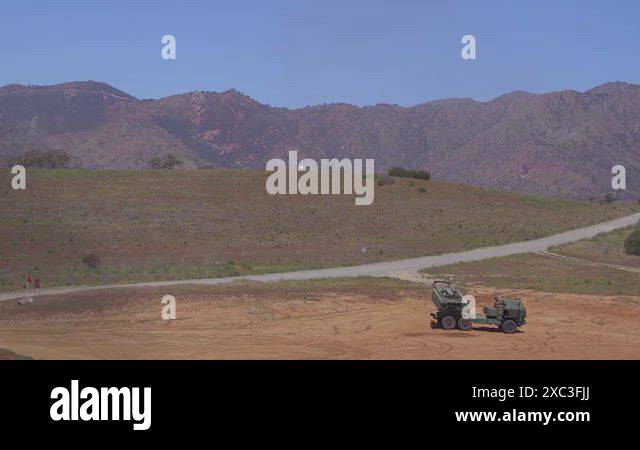 USA truck mounted rocket launchers fire rocket barrages and artillery ...