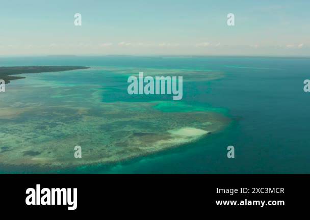 Sand bar among coral reefs in turquoise atoll water, top view. Summer ...