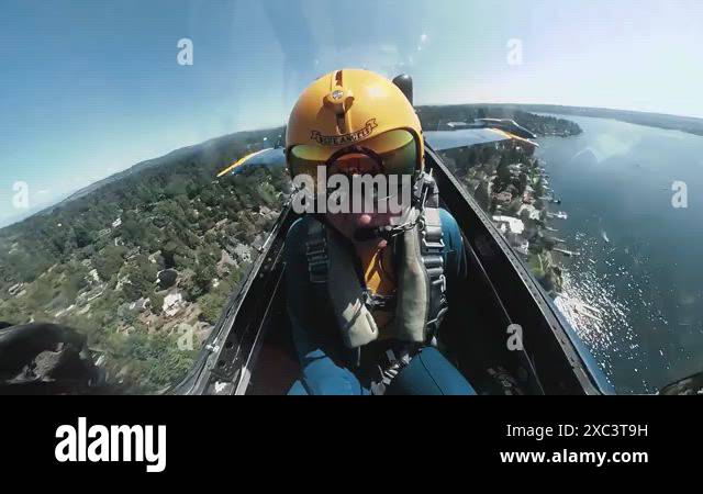 2019 - A US Navy Blue Angel pilot is seen in his aircraft, flying over ...