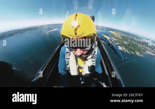 2019 - A US Navy Blue Angel pilot is seen in his aircraft, flying over ...
