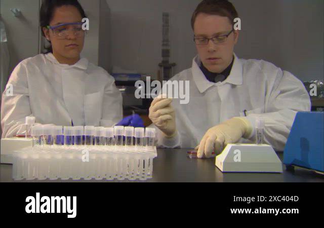 CDC scientists in appropriate personal protective equipment perform ...