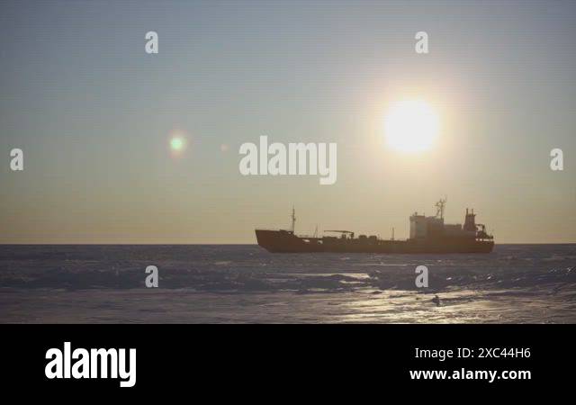 Time lapse fast motion of a Coast Guard icebreaker boat cutting it’s ...