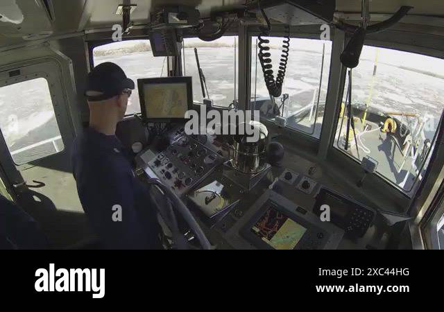 Time lapse fast motion of a Coast Guard icebreaker boat cutting it’s ...