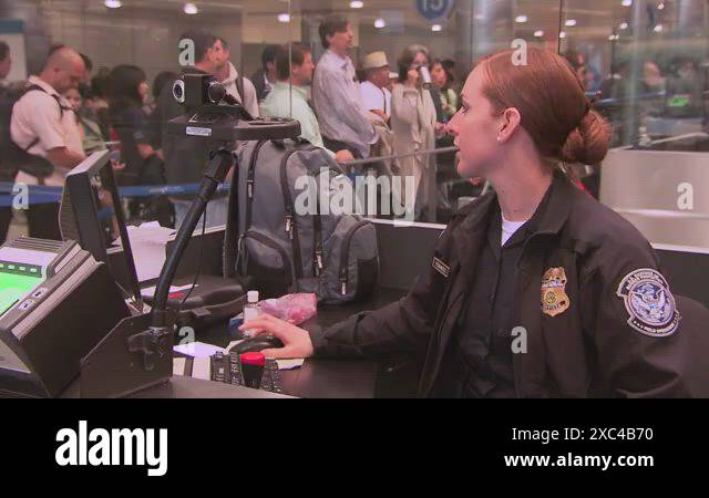 Passengers coming into an international airport terminal pass through U ...
