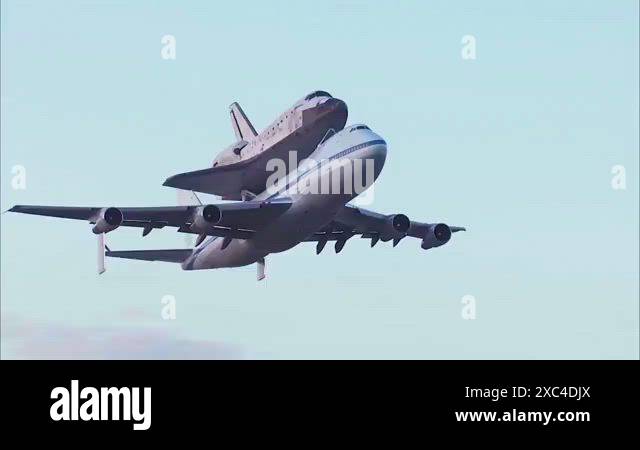 The Space Shuttle Discovery piggybacks on the back of a 747 Stock Video ...